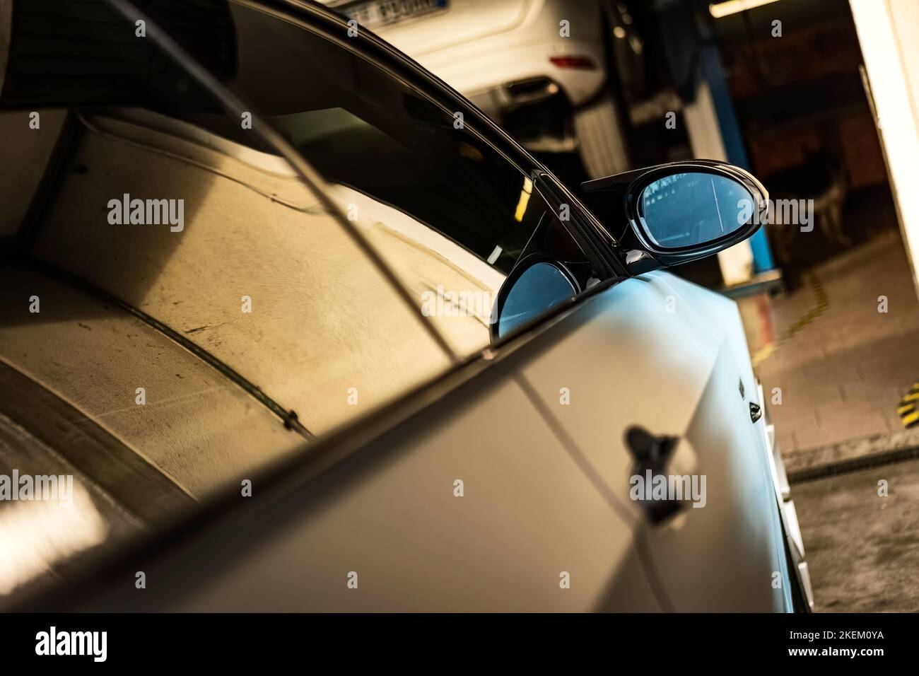 Tuned car rearview mirror detail. Car tuning detail Stock Photo - Alamy