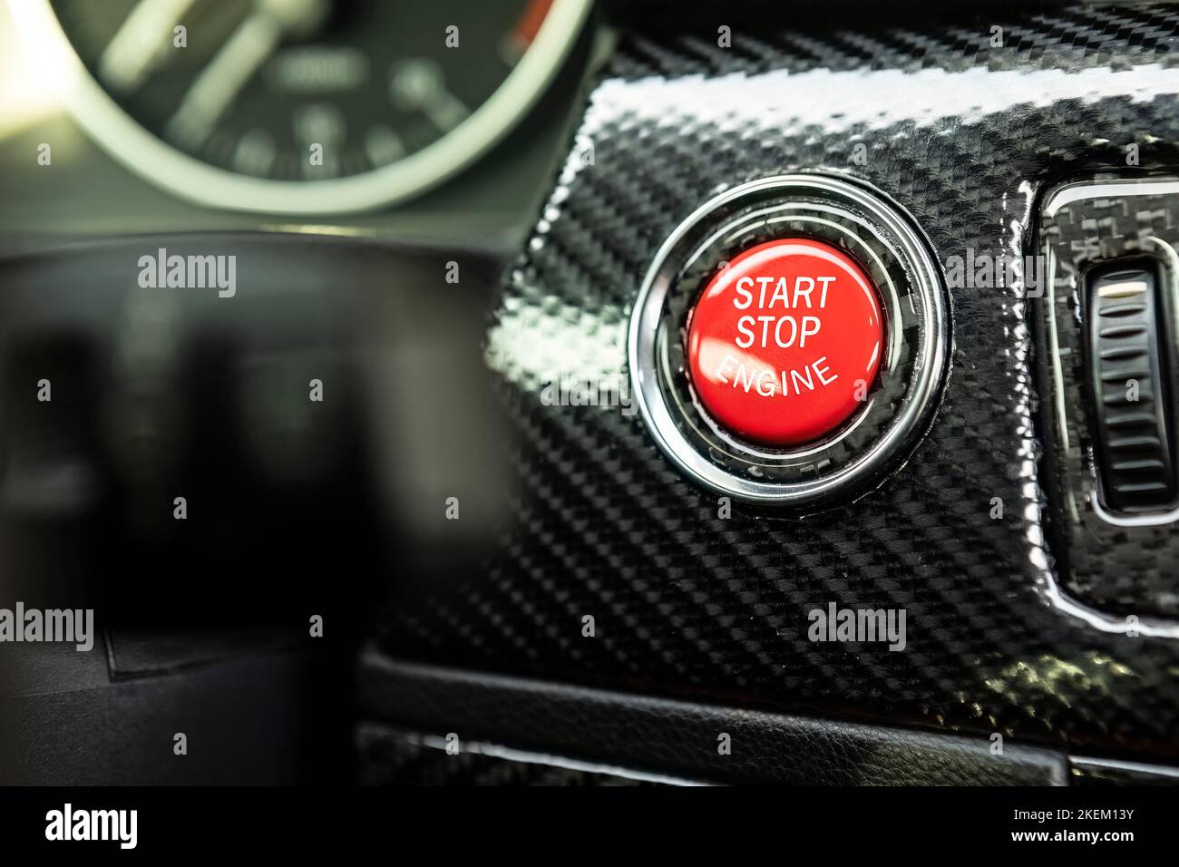 Red engine start button detail. Car dashboard with focus on red engine ...