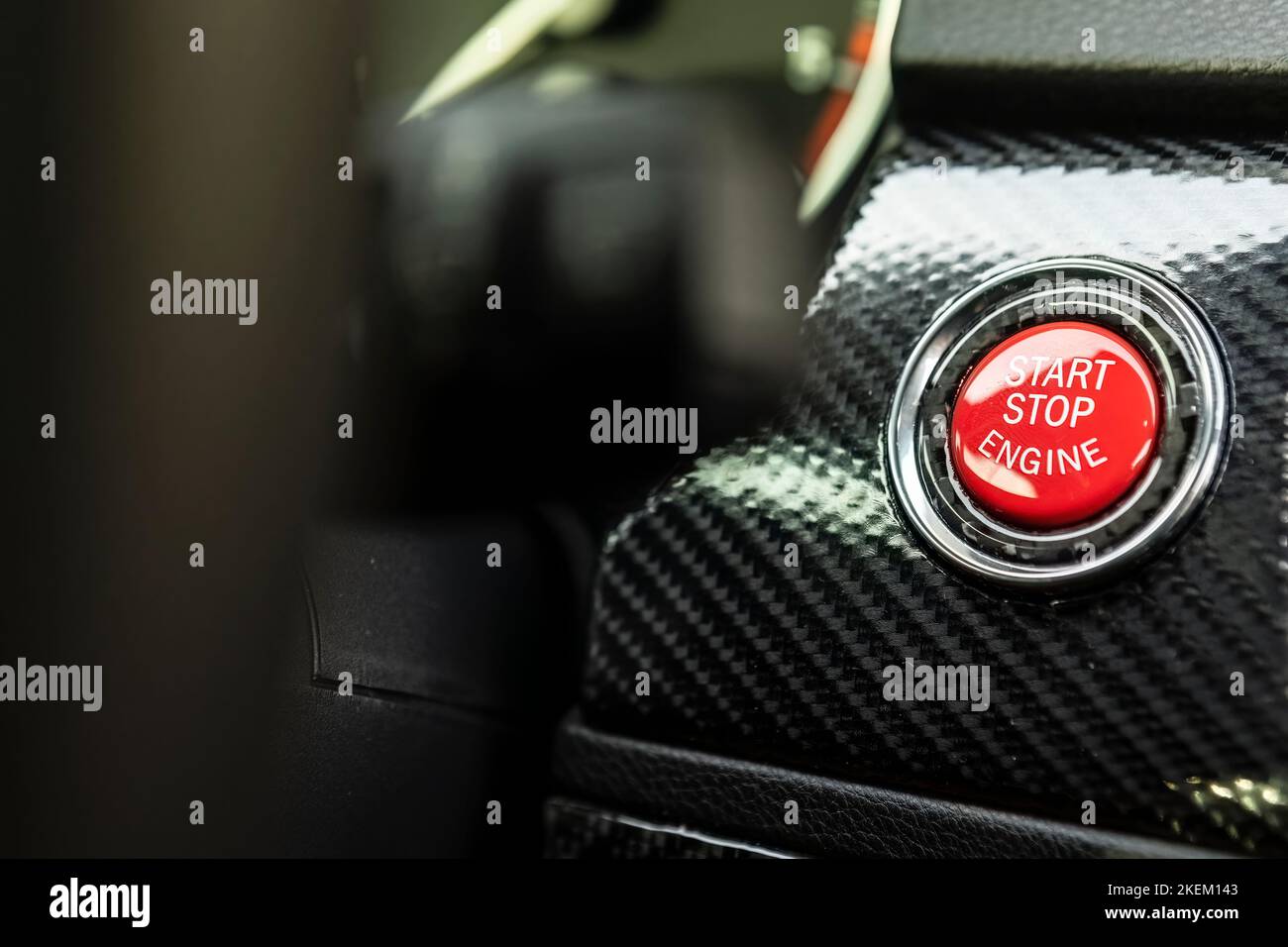 Red engine start button detail. Car dashboard with focus on red engine ...