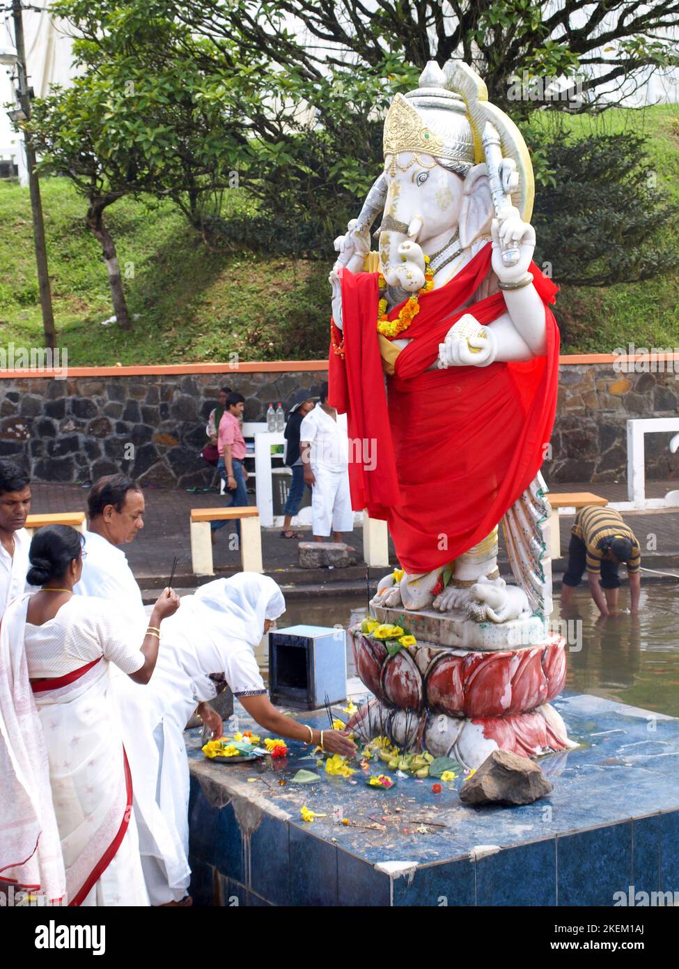 GRAND BASSIN, MAURITIUS - FEBRUARY 24, 2011: Pilgrims pray before the ...