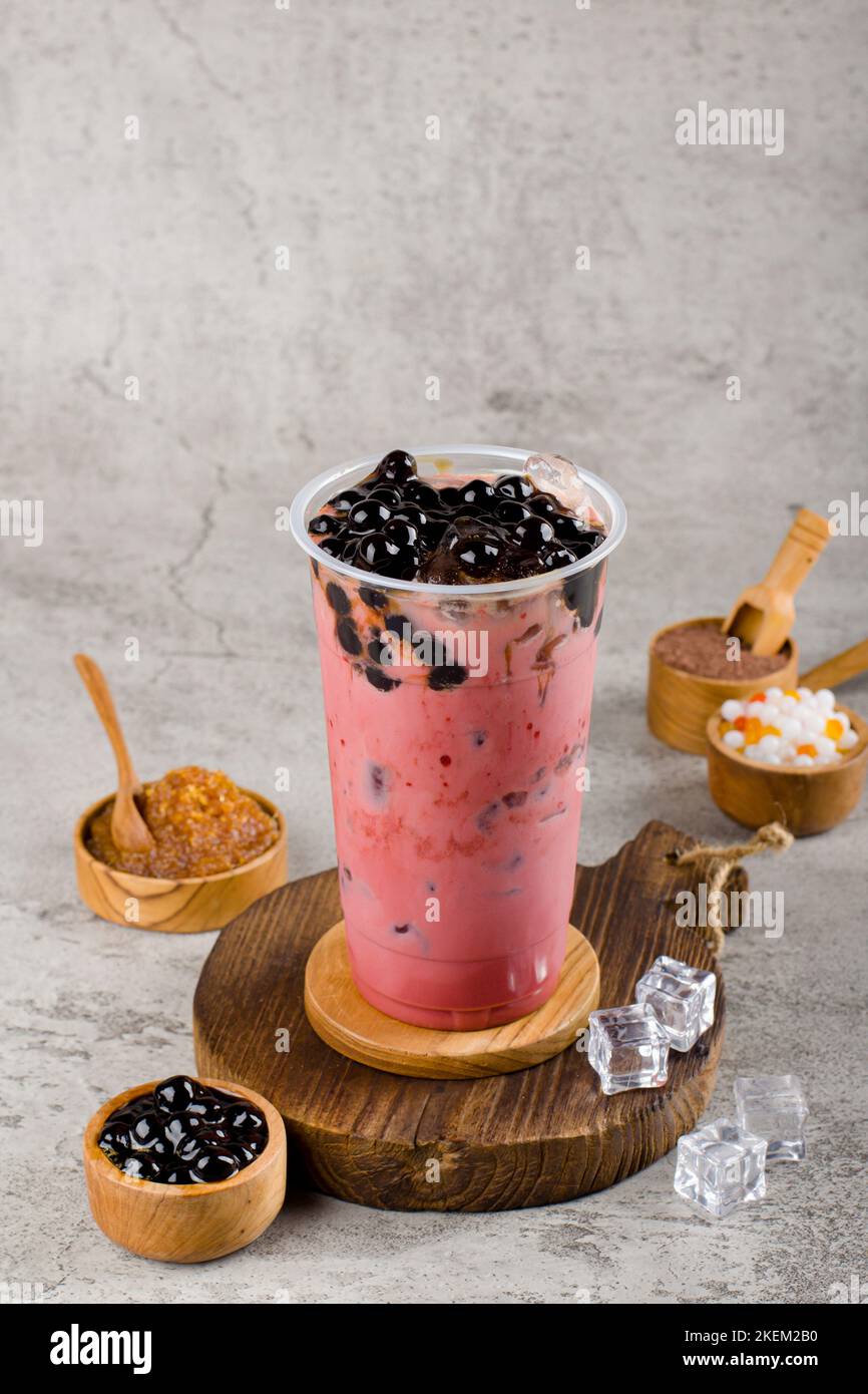 Boba or tapioca pearls is taiwan bubble milk tea in plastic cup with ...