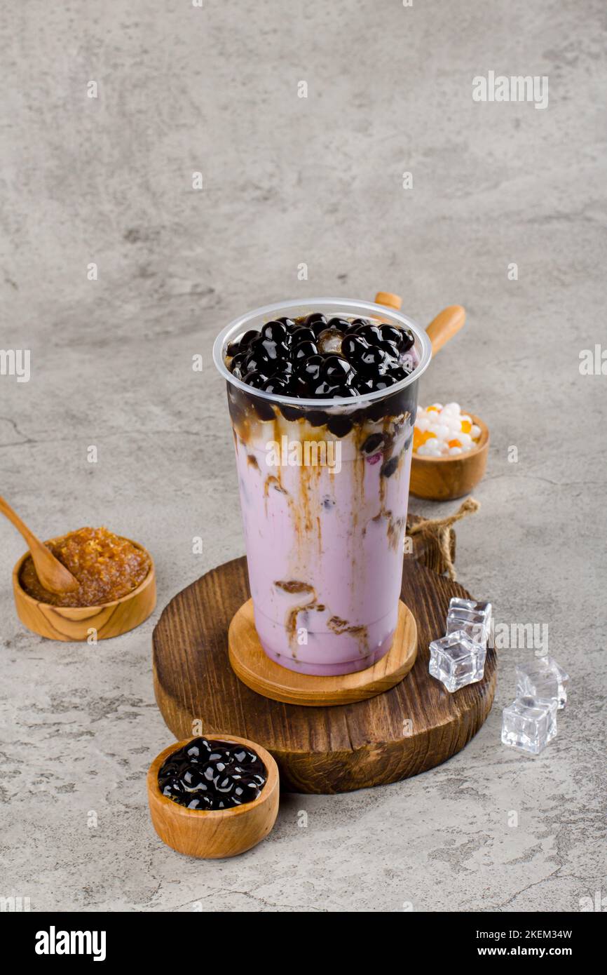 Boba or tapioca pearls is taiwan bubble milk tea in plastic cup with ...
