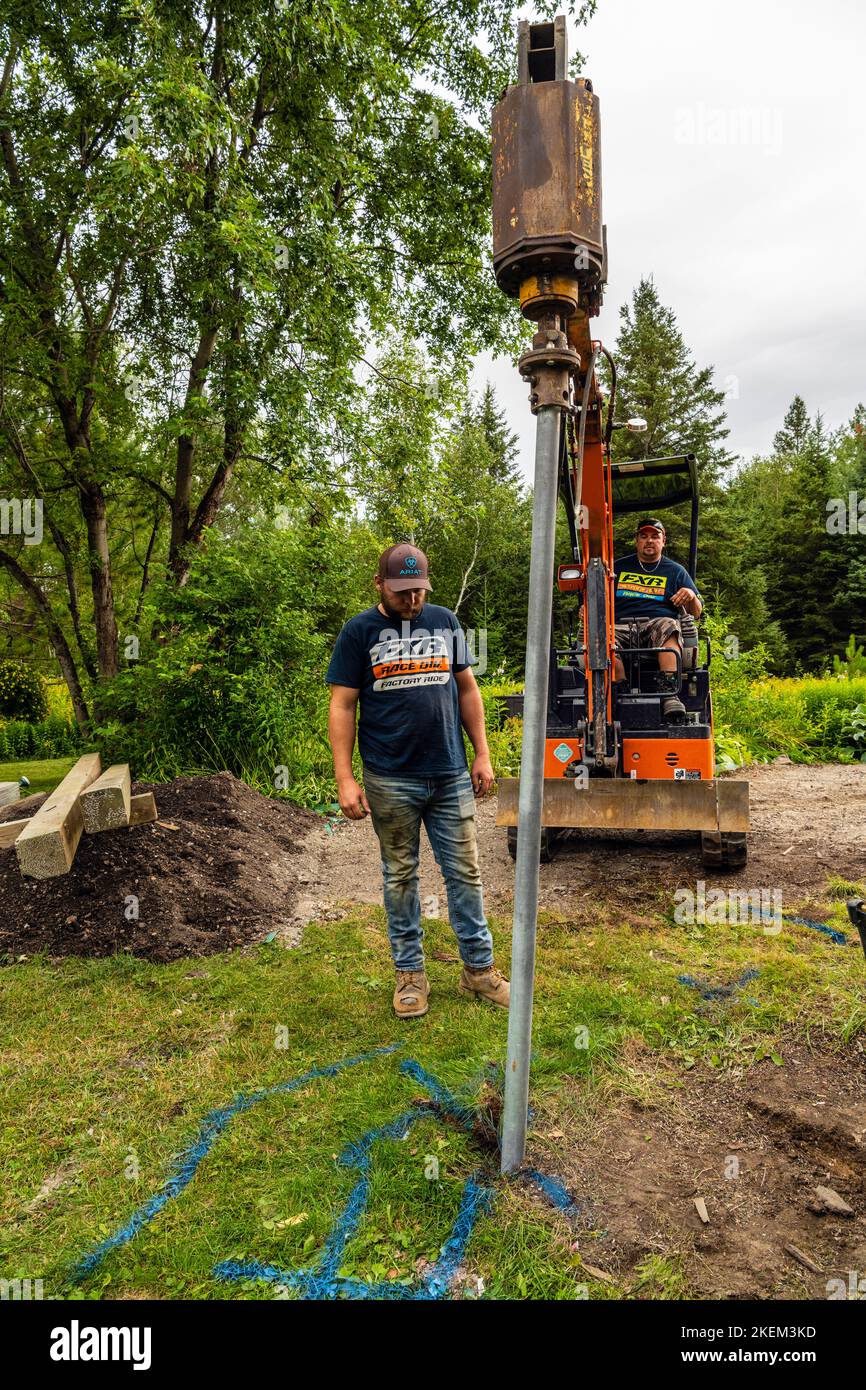 Ryan McAbe (Push plow ltd) installing helical support posts for a new ...