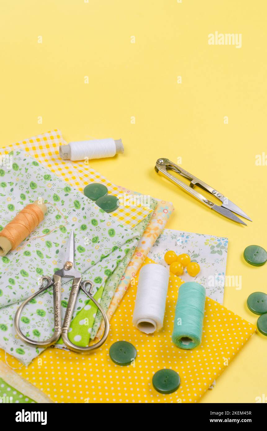 A set of sewing accessories for sewing, spools of thread, fabrics ...