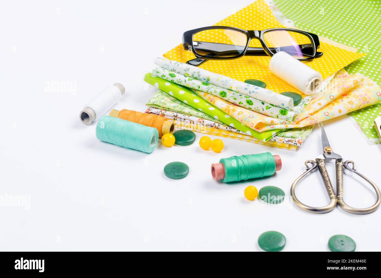 A set of sewing accessories for sewing, spools of thread, fabrics ...