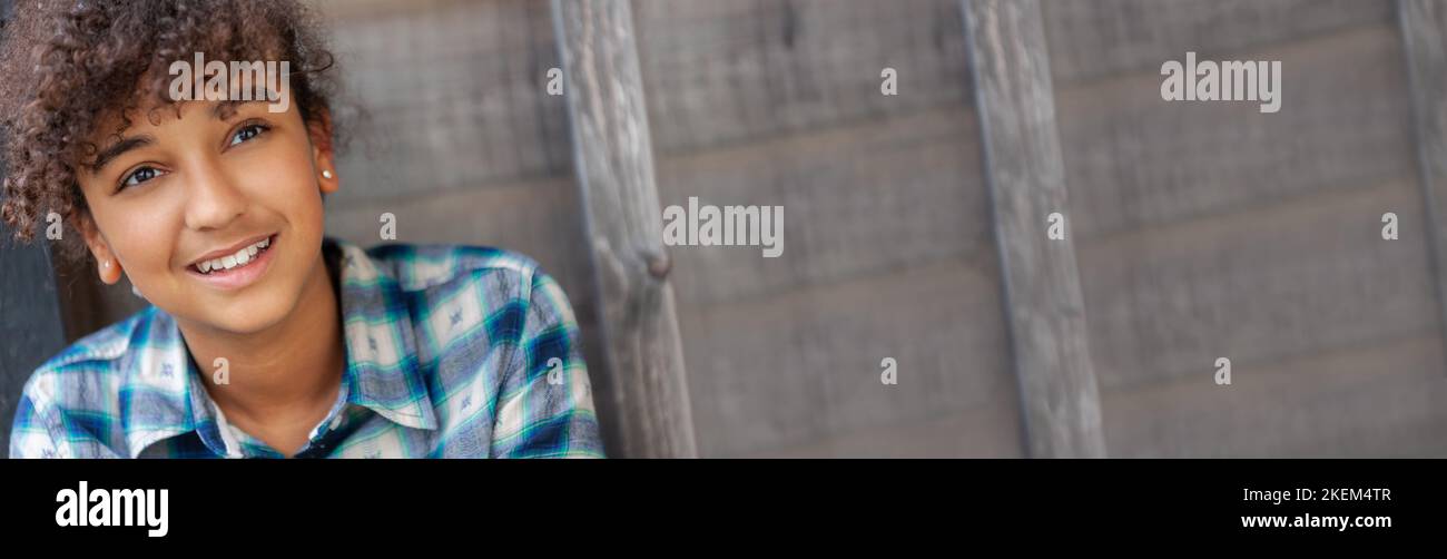 Outdoor panoramic portrait of beautiful happy biracial African American ...