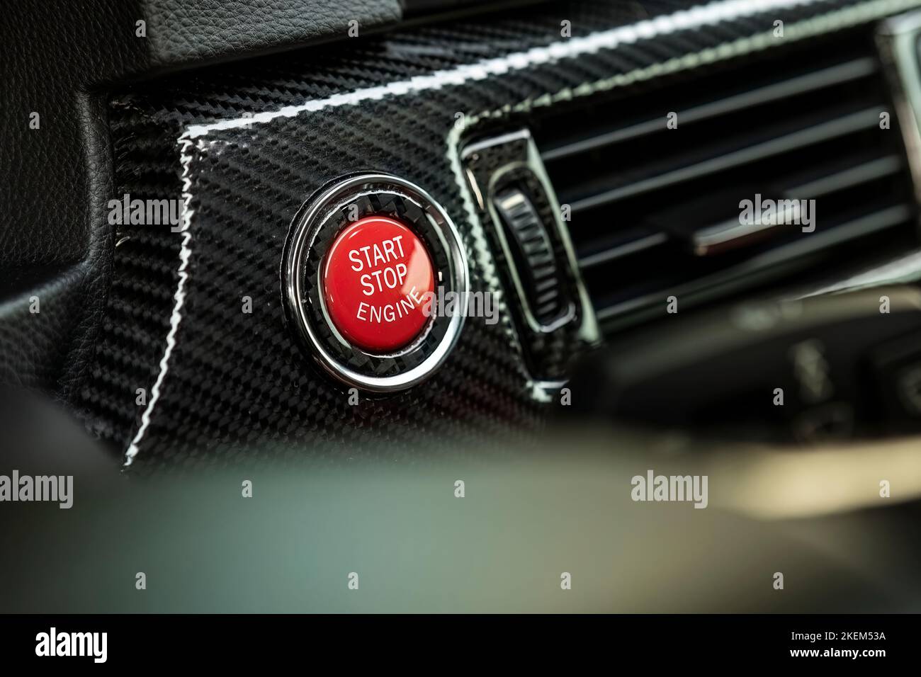 Red engine start button detail. Car dashboard with focus on red engine ...