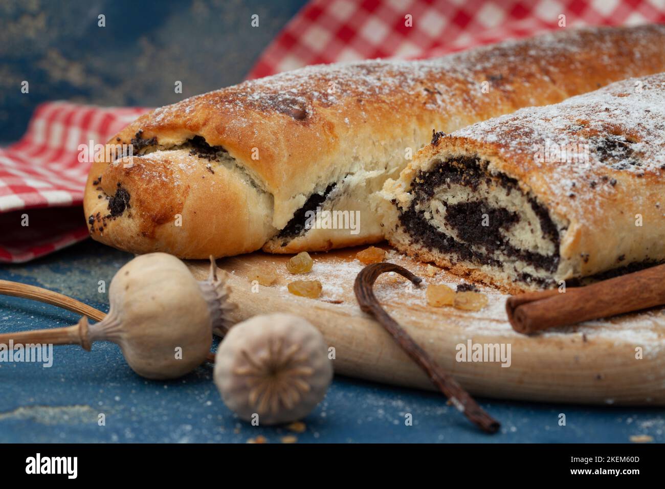 Homemade poppy seed strudel on wooden board. Cut across. Sweet Poppy ...