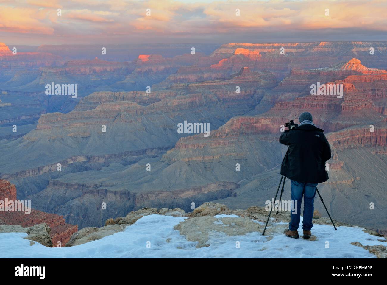 Photographer at the Grand Canyon at sunrise in winter, from Hopi Point ...