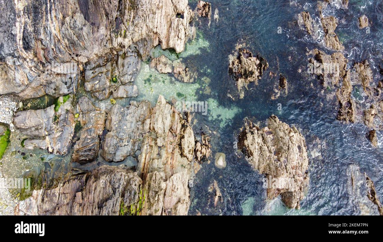 Drone photo. View from above. A lot of boulders in the sea water, top ...