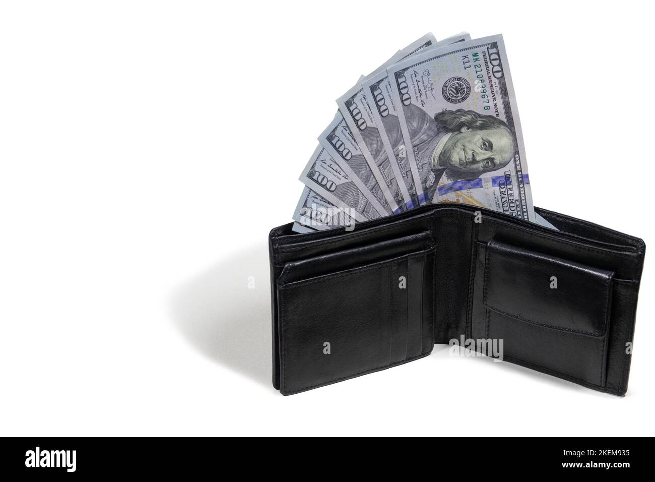 Black leather wallet with dollars isolated on white background. One ...