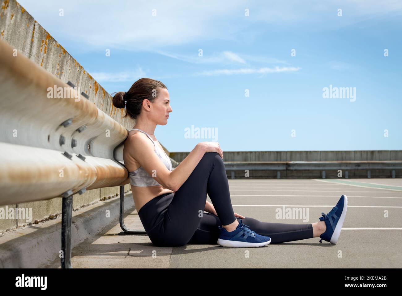 sport and lifestyle concept - woman resting after doing sports outdoors ...