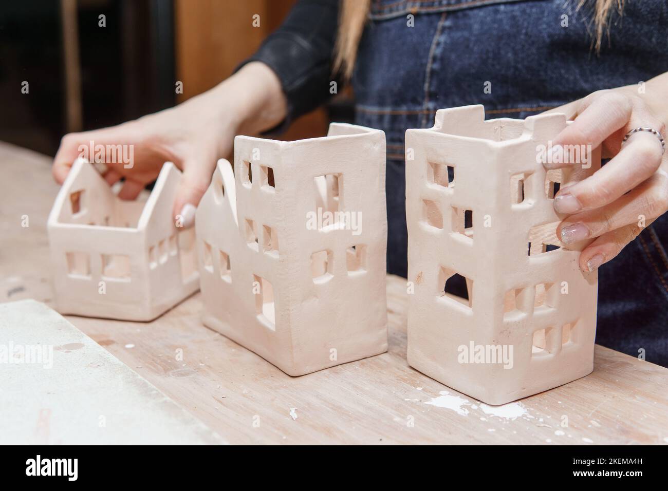 A master ceramist holds a clay product in his hands. Making a ceramic ...