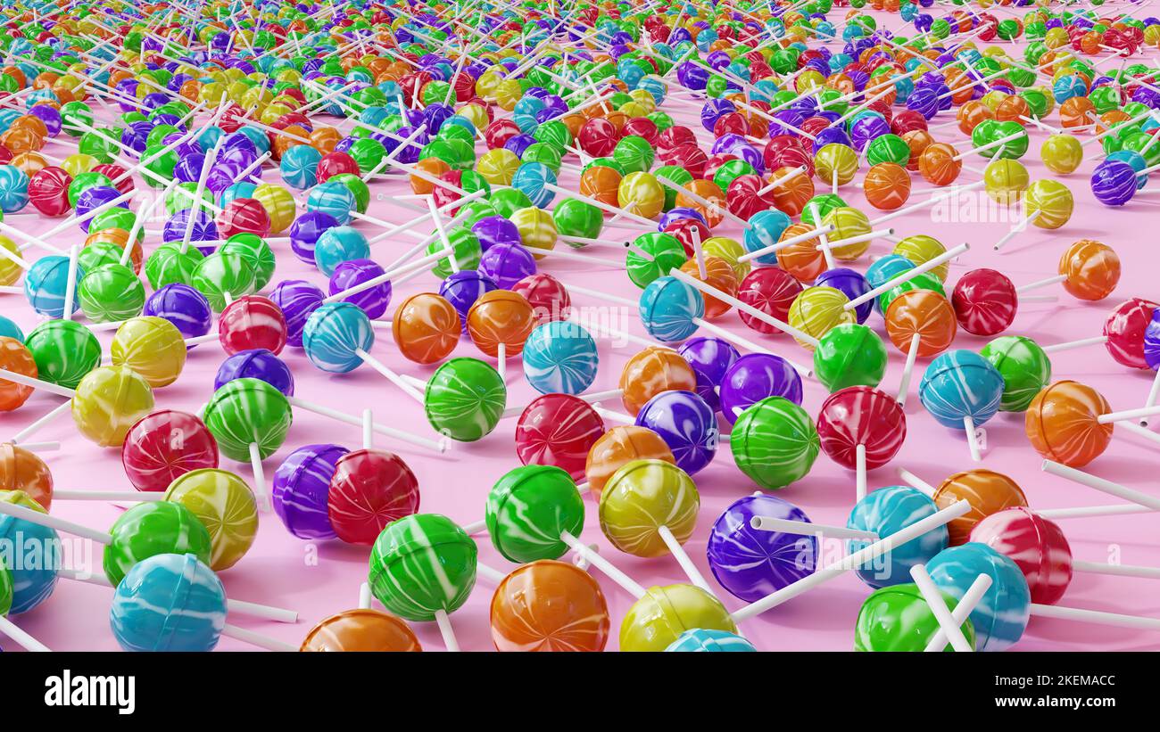 Colorful orange blue purple yellow and green lollipops over pink ...