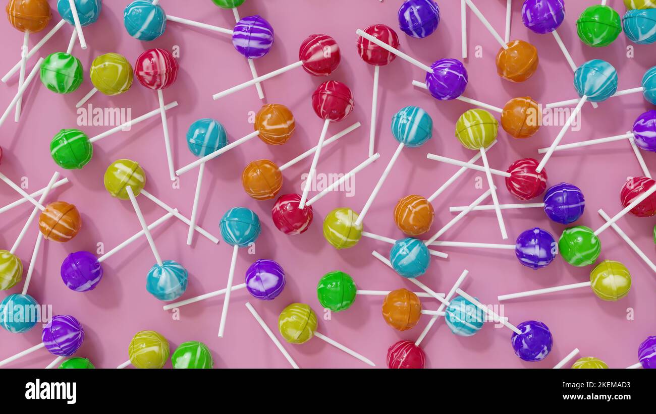 Colorful lollipops. Top view under pink background Stock Photo - Alamy