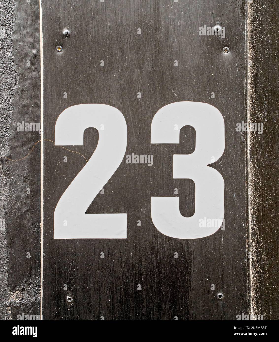 Metal shop front shutter with number 23 Stock Photo - Alamy