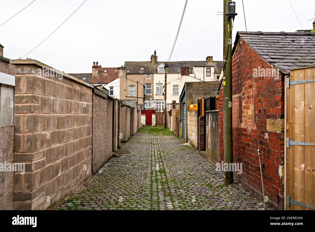 Narrow alley between houses, town architecture Stock Photo - Alamy