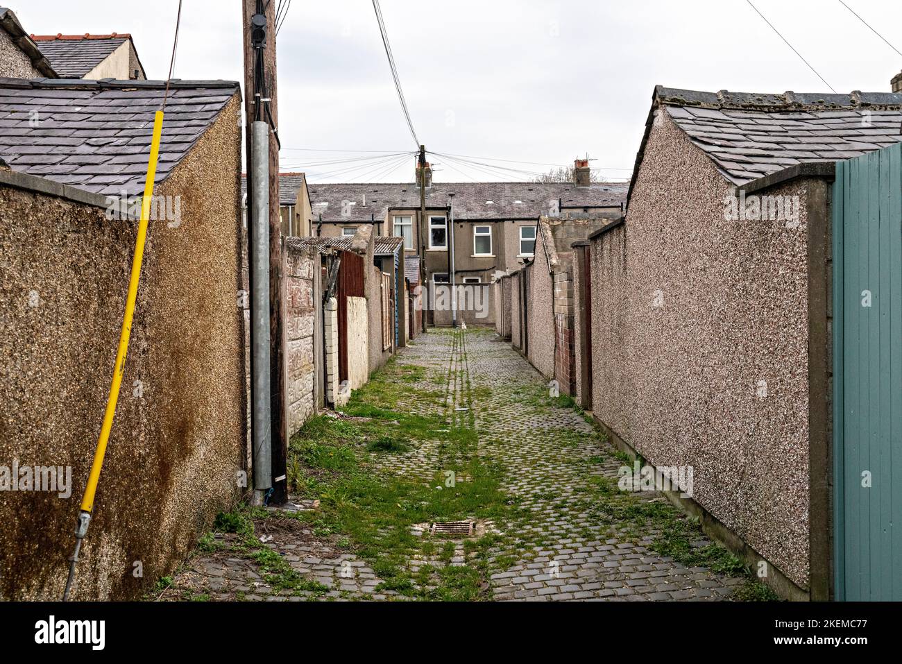 Narrow alley between houses, town architecture Stock Photo - Alamy