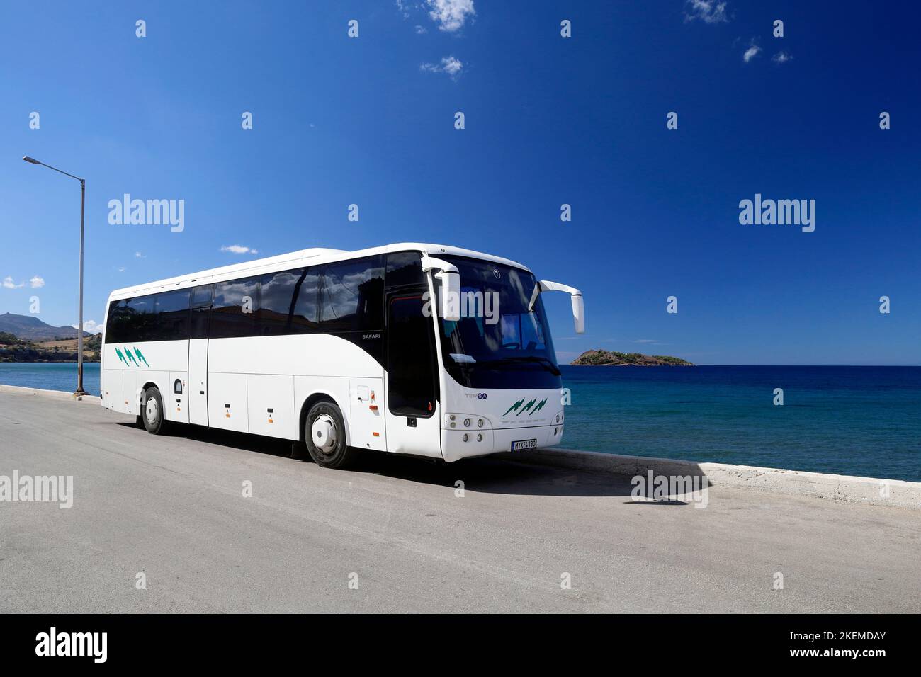 Attractive view of a coach against background of sea and blue sky ...