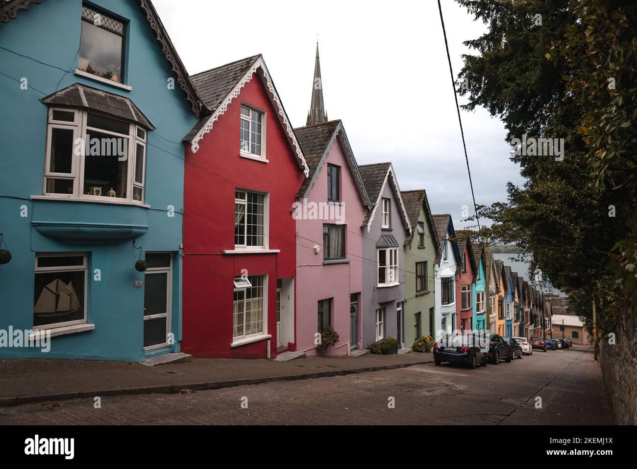 Colorful row of houses with towering cathedral in background in the ...
