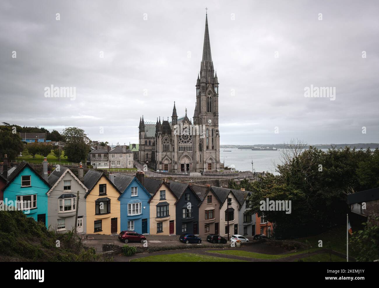Colorful row of houses with towering cathedral in background in the ...