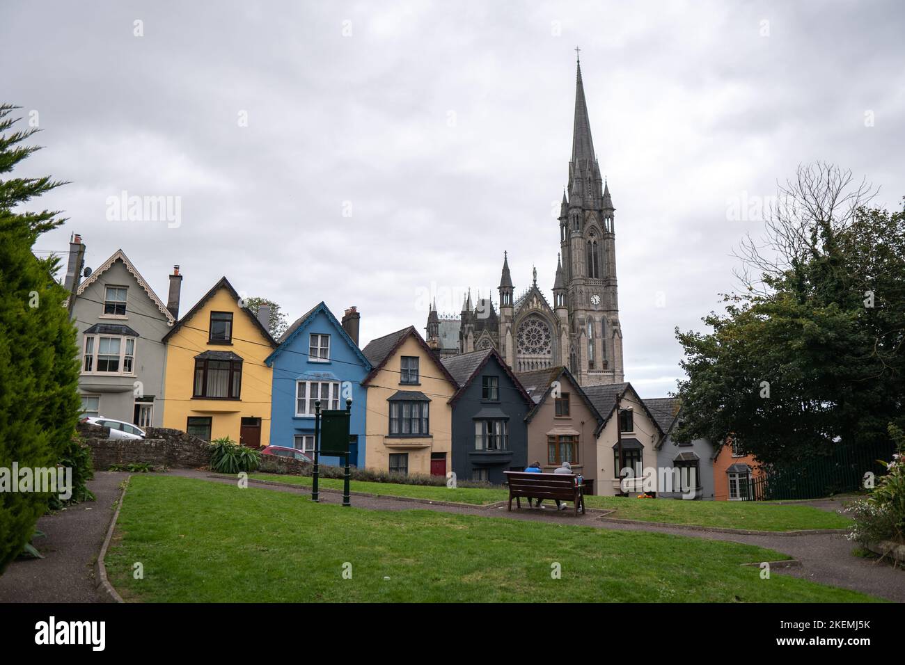 Colorful row of houses with towering cathedral in background in the ...