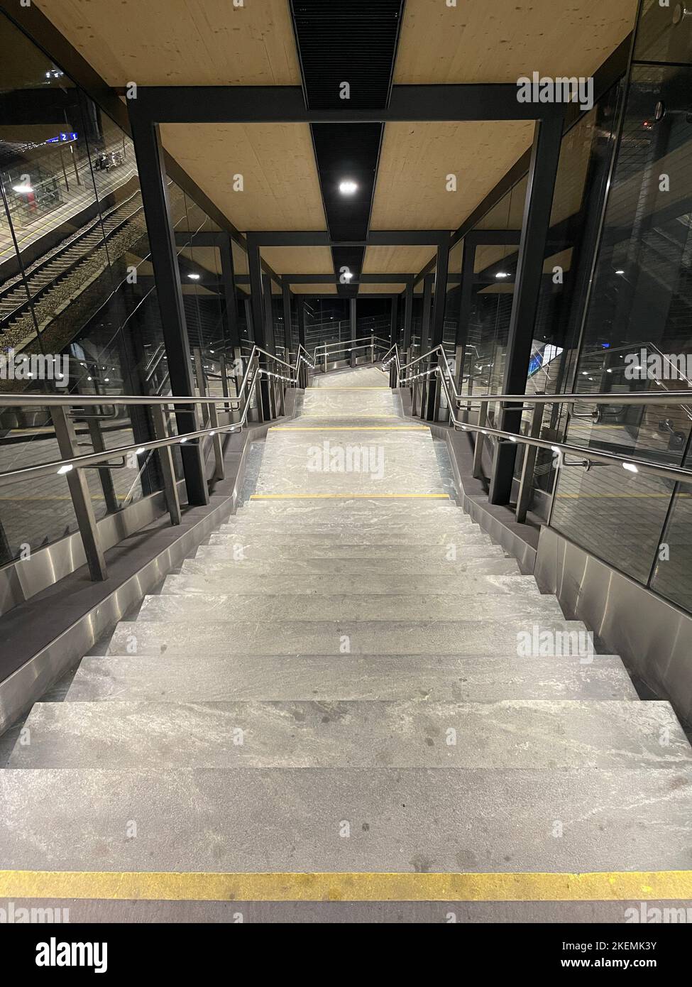 Top view perspective shot of a modern grey stairs between glass walls ...