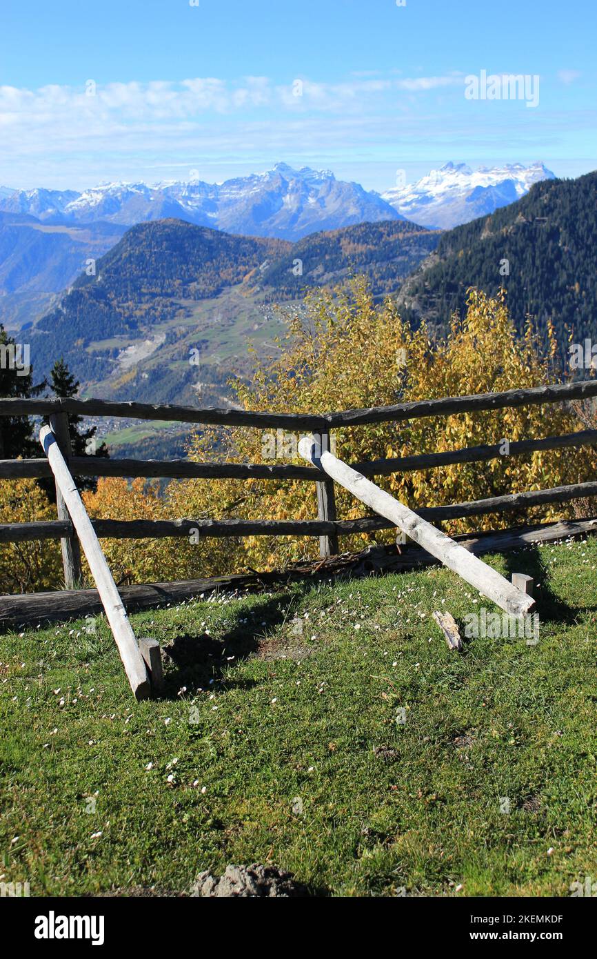 Verbier alpine lookout in autumn with wooden fence in the foreground ...