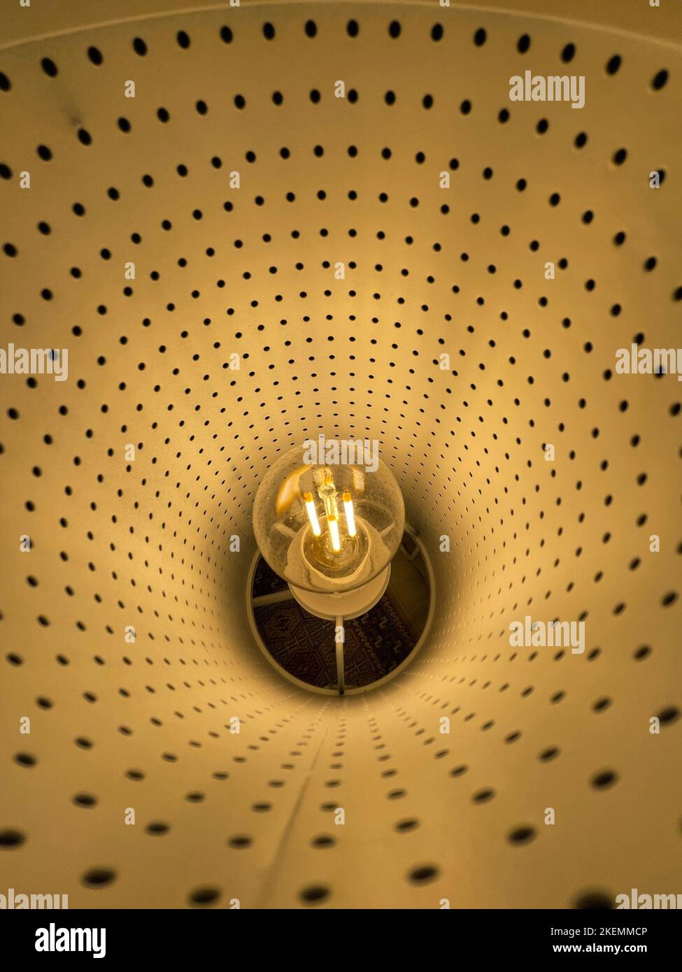 Top view shot of a vintage style lightbulb glowing in a floor lamp ...