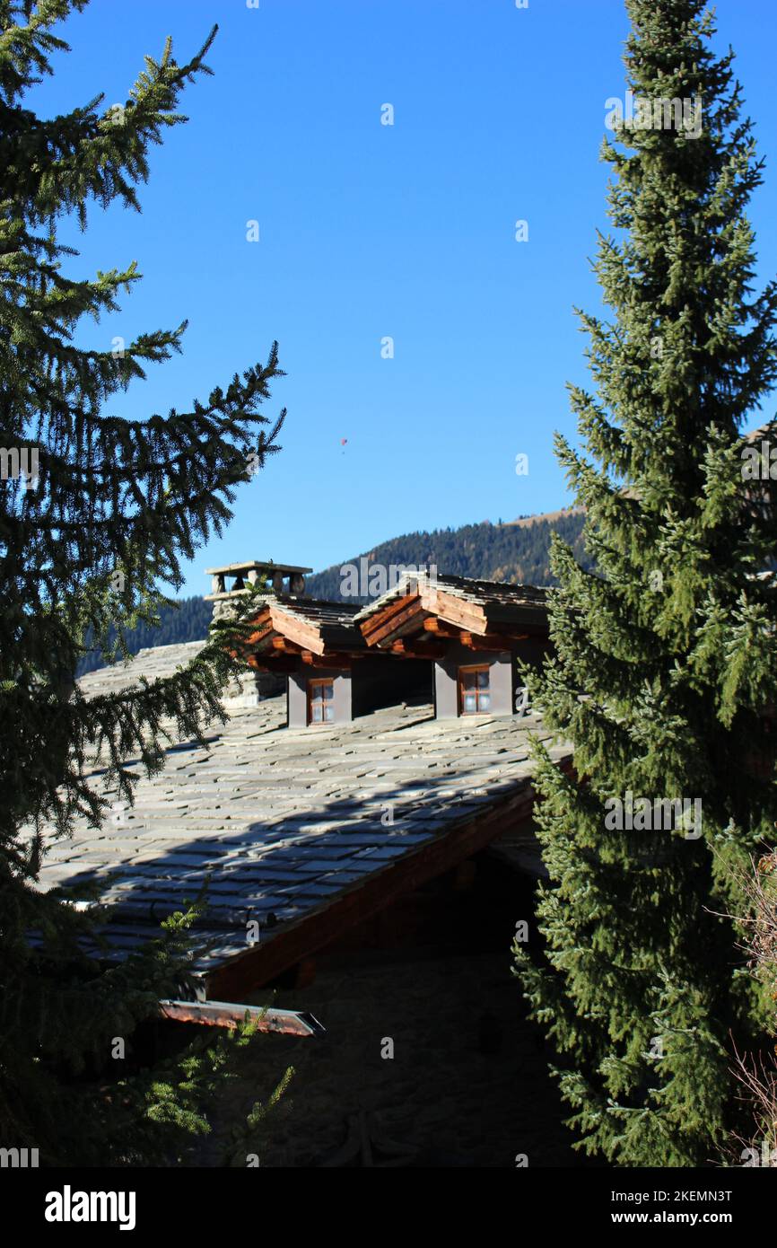 Typical alpine, Swiss wooden roof with stone slate overtop and alpine ...