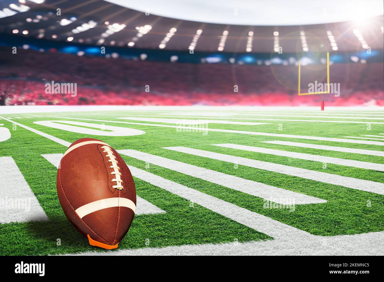 American football stadium with goal post and ball on tee ready for ...