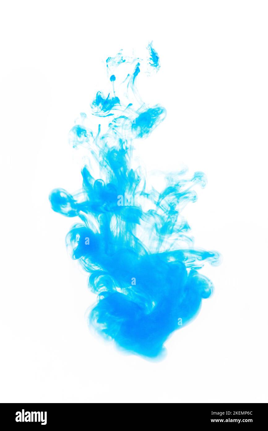 A vertical shot of of a blue ink drop into the water isolated on an ...