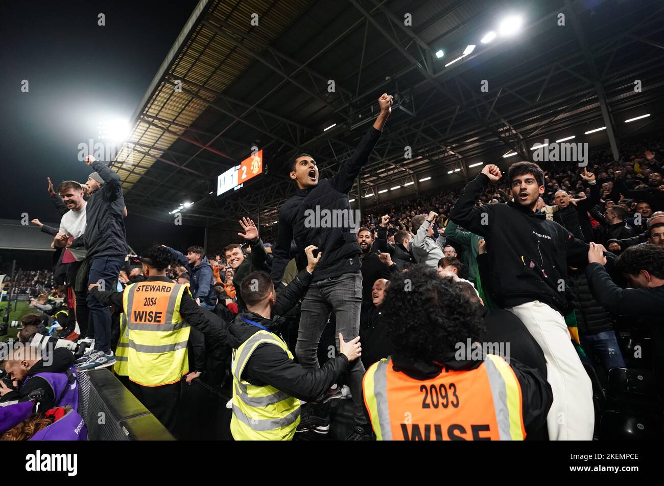 Manchester United fans celebrate in the stands during the Premier ...