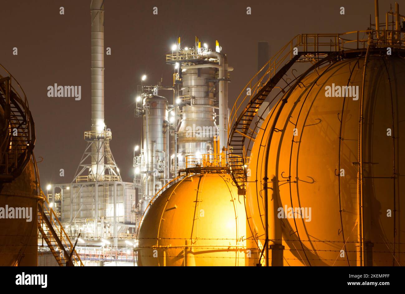 A large oil-refinery plant with Liquefied Natural Gas - LNG - storage ...