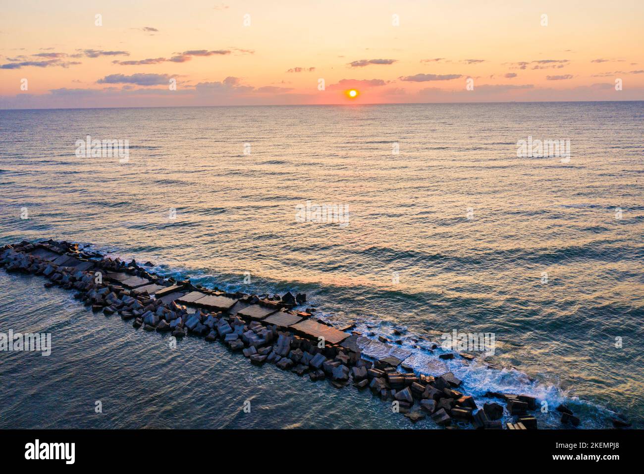 Aerial view of wave breaker at sunrise, summer resort view Stock Photo ...