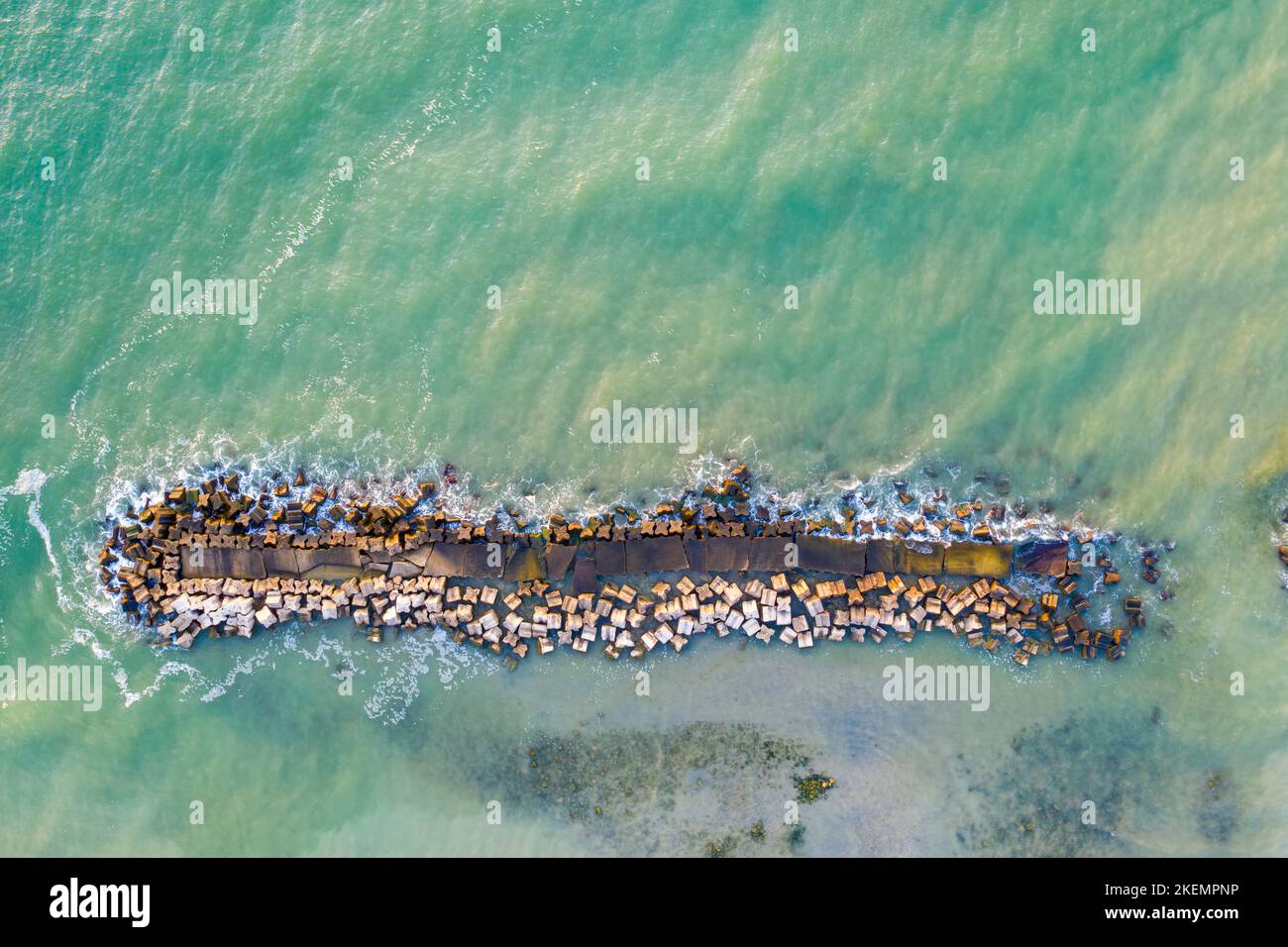 Wave breakers along the beaches viewed from above, summer resort at the ...