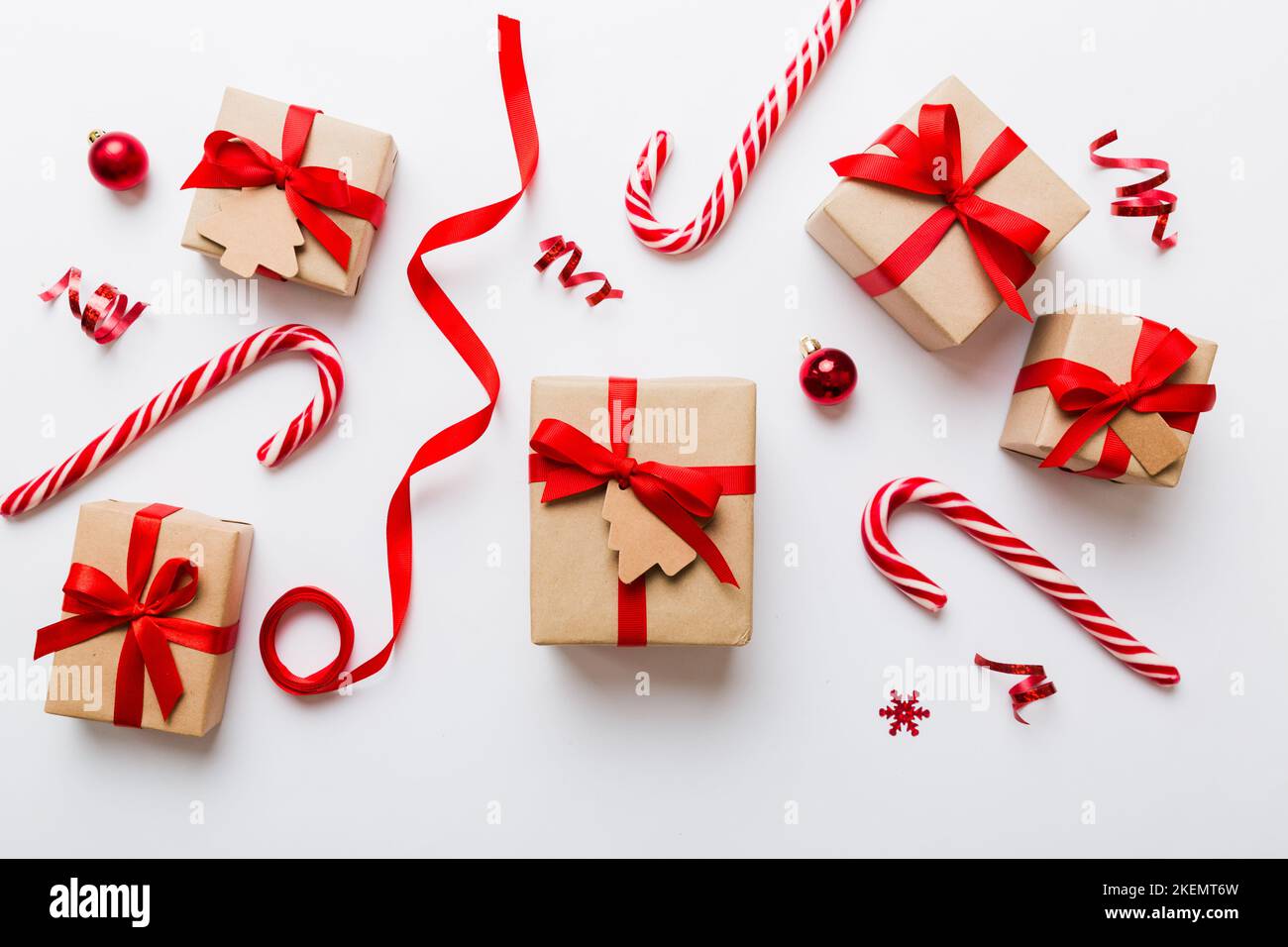 Christmas kraft gifts box with ribbon on colored background. Cozy ...