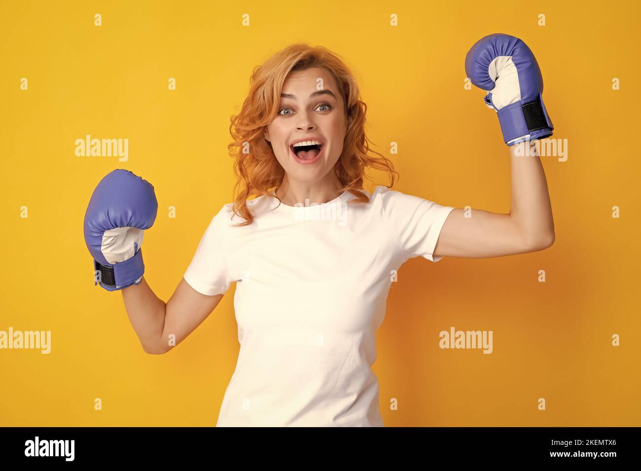 Cheerful woman celebrating victory. Winner female boxer Isolated on ...