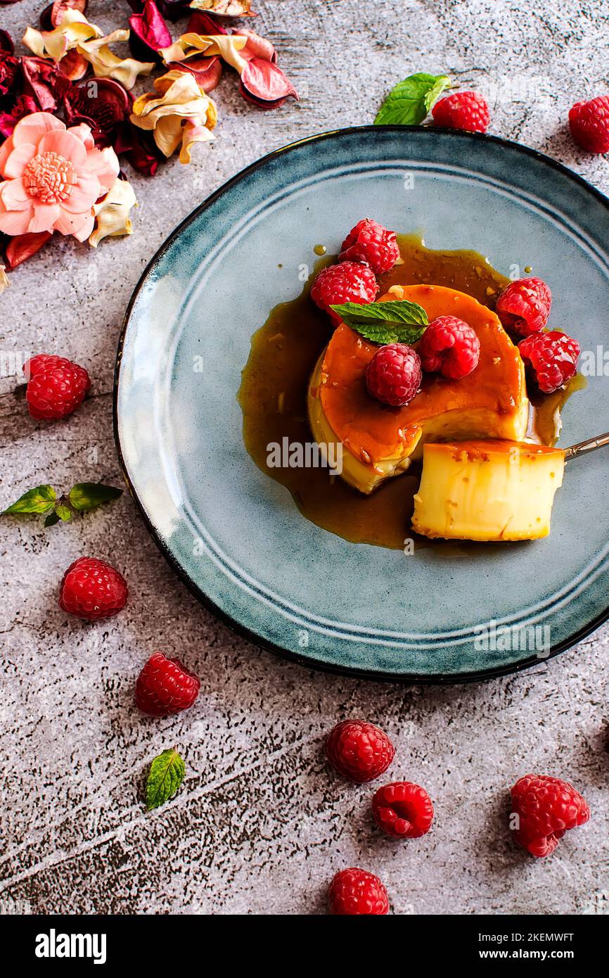 Custard with egg custard caramel flan dessert with raspberries Stock ...