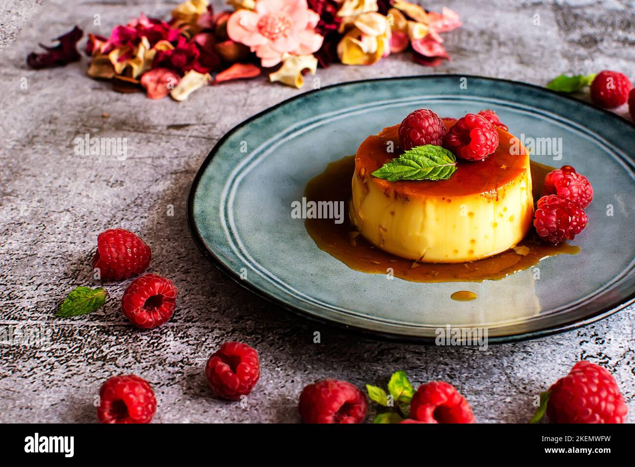 Custard with egg custard caramel flan dessert with raspberries Stock ...