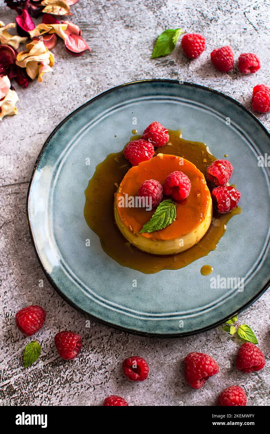 Custard with egg custard caramel flan dessert with raspberries Stock ...