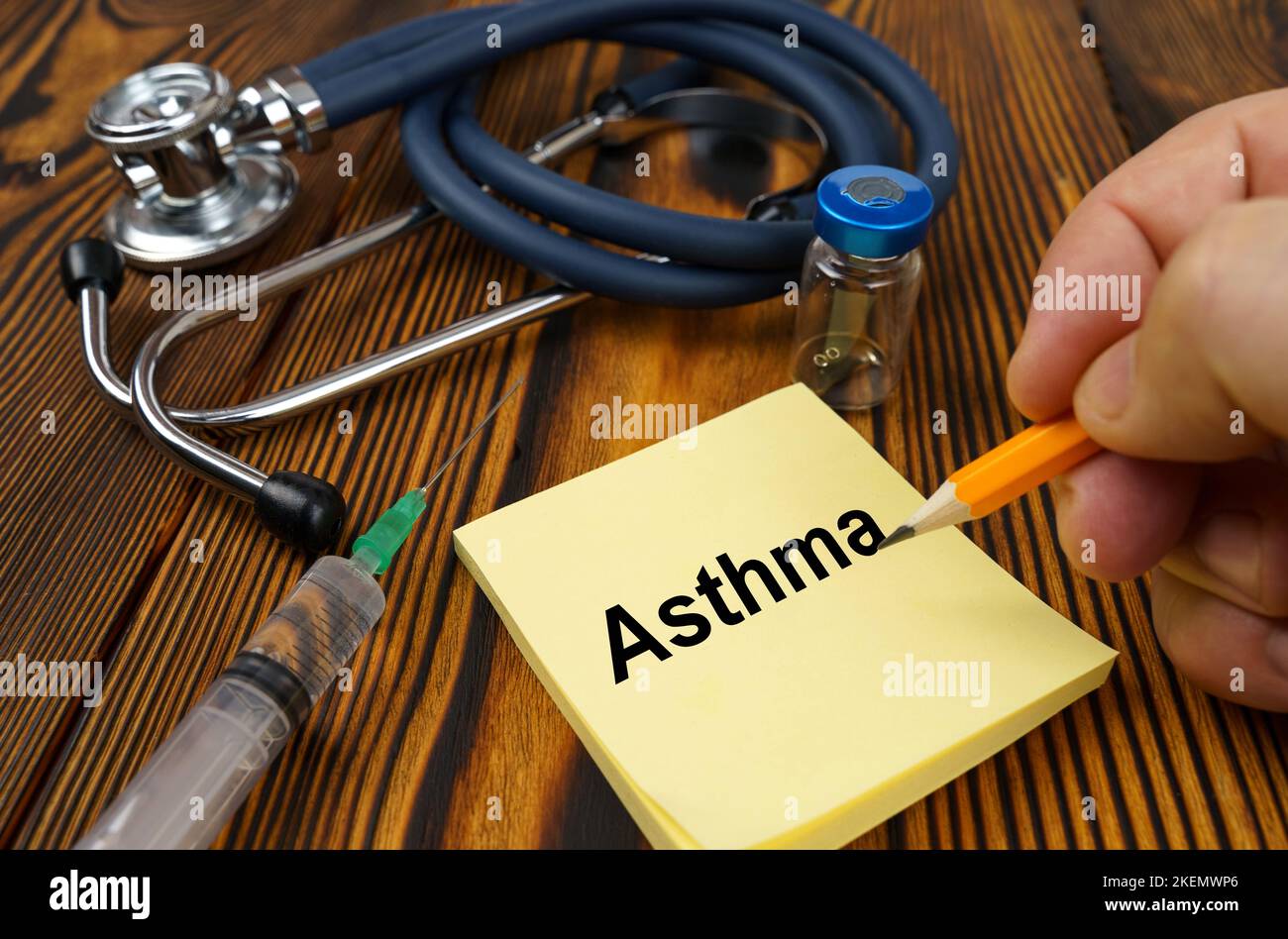 Medical concept. On the table is a stethoscope, a syringe, a man's hand ...