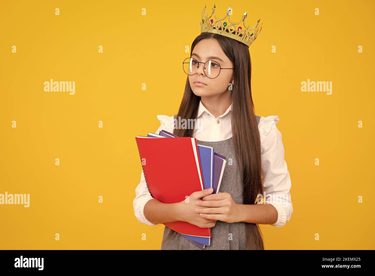 Schoolgirl nerd princess in school uniform and crown celebrating ...