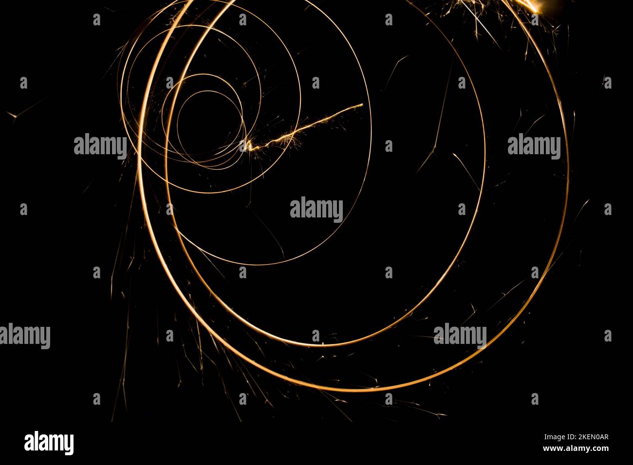 Sparks from the circular rotation of lights on a black background Stock ...