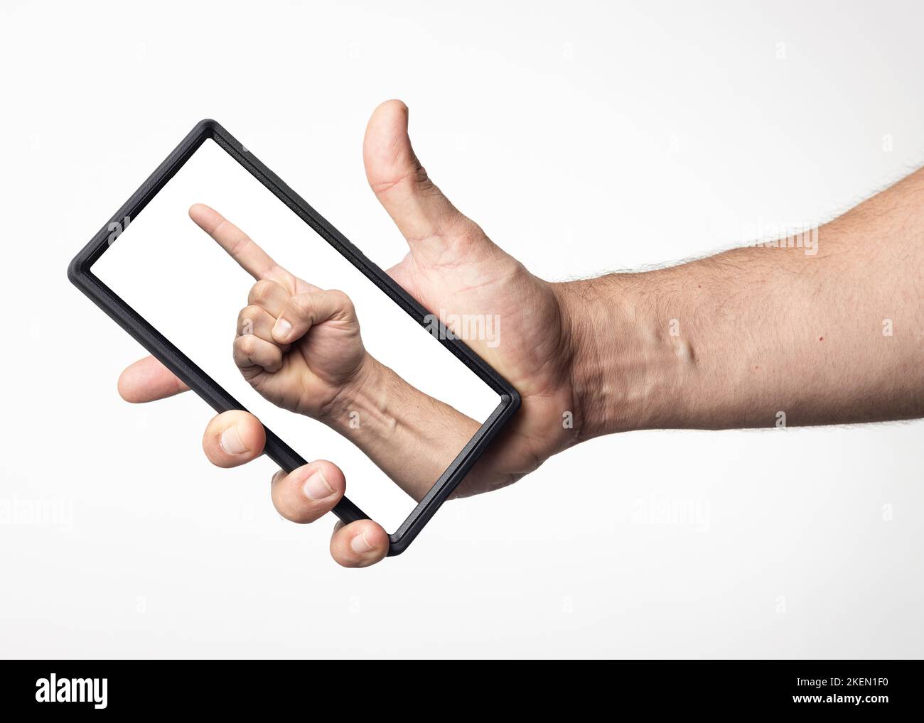 Photomontage showing a hand inside a cell phone screen held by another ...