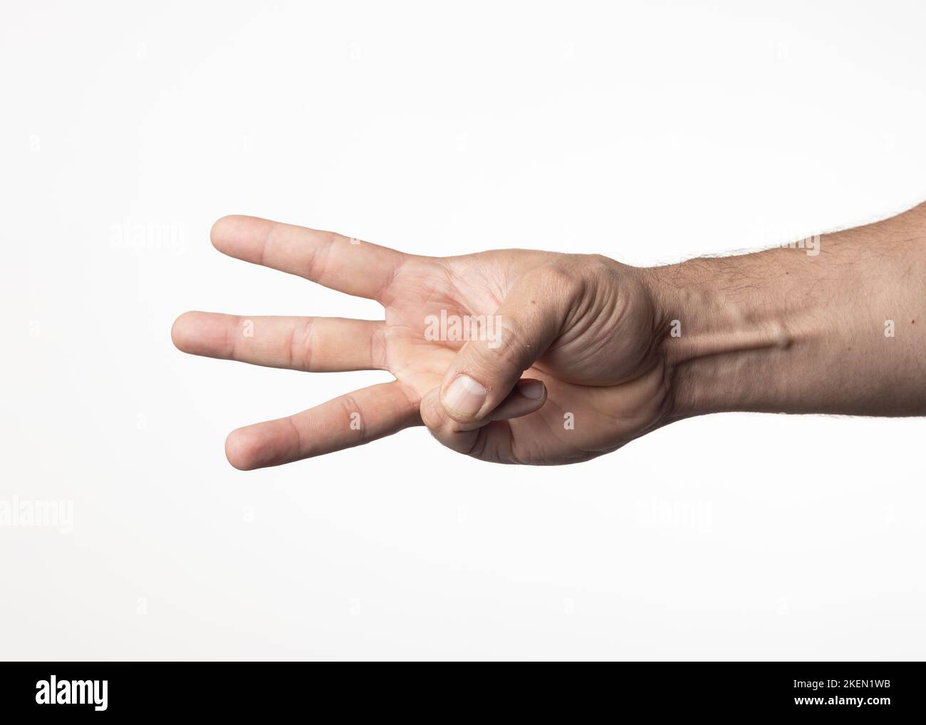 A man's hand and arm on a nuclear white background, showing a gesture ...