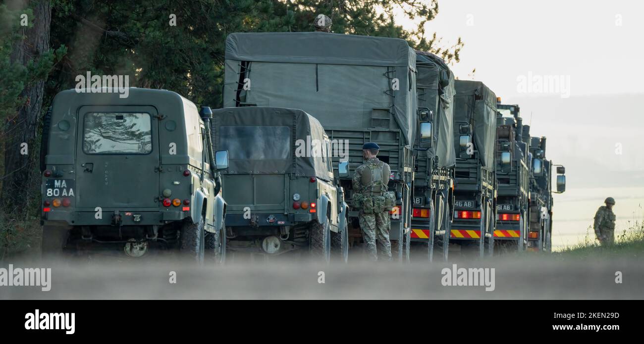 Britrish army Defender Wolf and MAN SV 4x4 Utility Trucks queued along ...