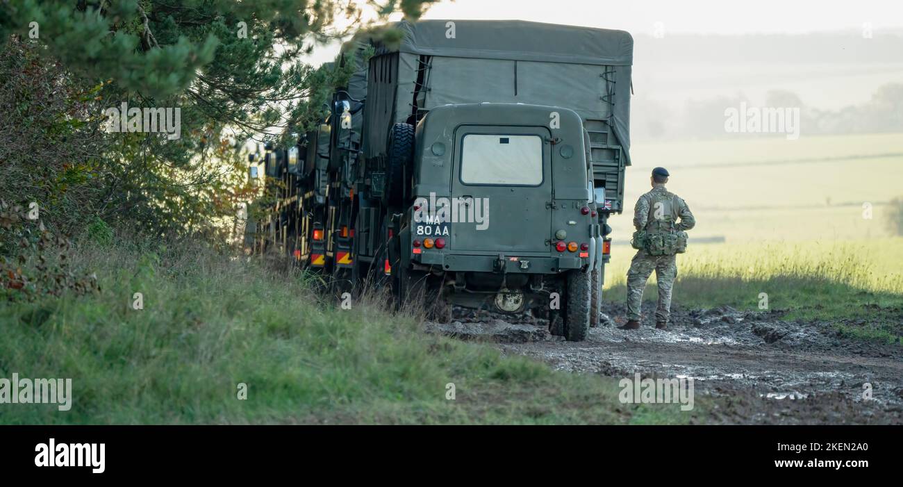 Britrish army Defender Wolf and MAN SV 4x4 Utility Trucks queued along ...