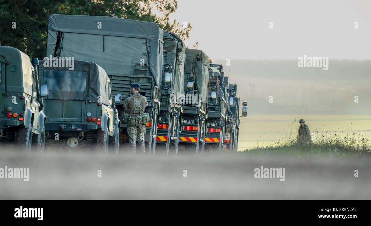 Britrish army Defender Wolf and MAN SV 4x4 Utility Trucks queued along ...