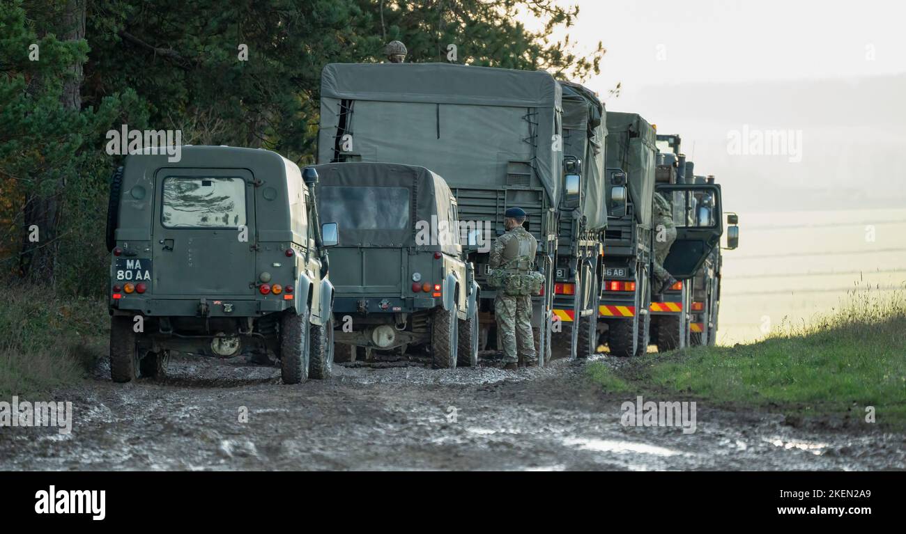 Britrish army Defender Wolf and MAN SV 4x4 Utility Trucks queued along ...